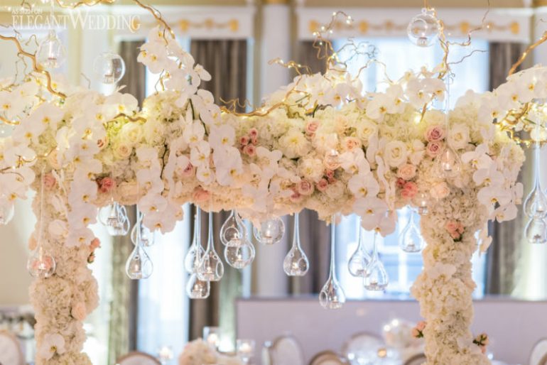 Elegant-white-flower-arch | PreOwned Wedding Dresses