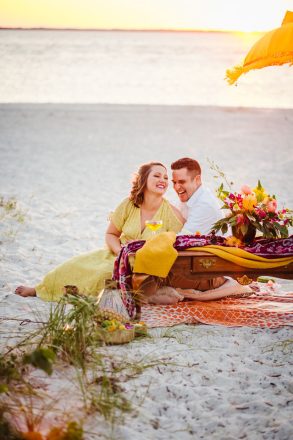 A colorful and tropical Bali inspired anniversary shoot at sunset on the beach in Tampa by ...