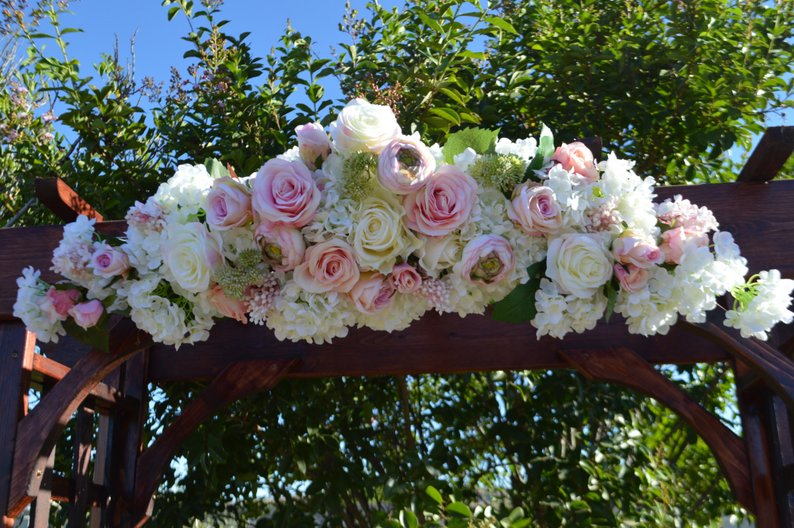 Rose-Filled Wedding Arch | PreOwned Wedding Dresses